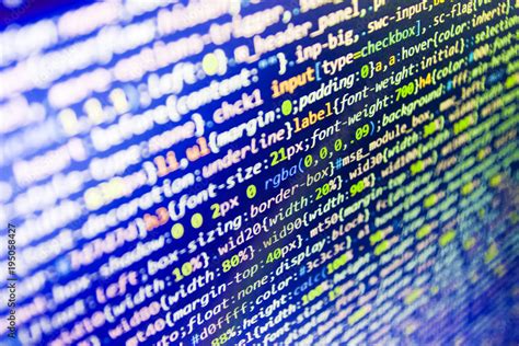 digital technology on display writing programming code on laptop