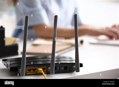 Modern Wi Fi Router On Light Table In Office Stock Photo Alamy