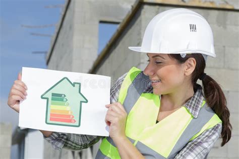 Female Builder Showing Energy Efficiency Rate On House Model Stock Image Image Of Orange