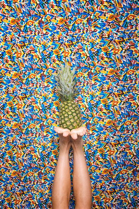 Womans Legs Holding Pineapple By Stocksy Contributor Danil Nevsky