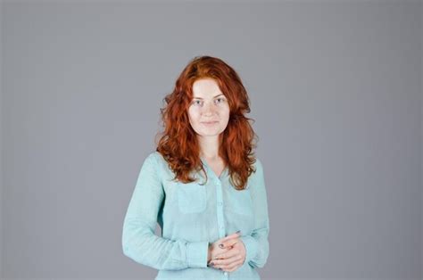 Premium Photo Portrait Of Beautiful Young Woman With Red Curly Hair