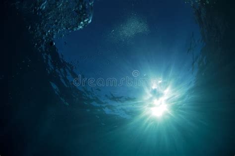 The Sun S Rays Pierce The Seabed At Sunset Stock Image Image Of