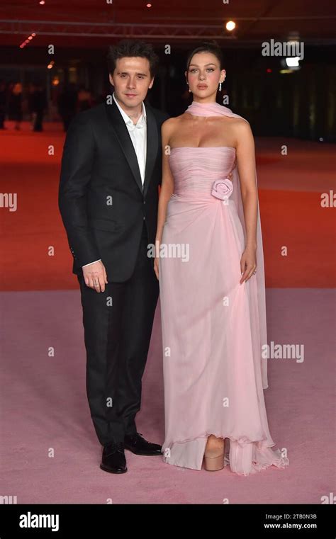Brooklyn Beckham Left And Nicola Peltz Beckham Attend The Third