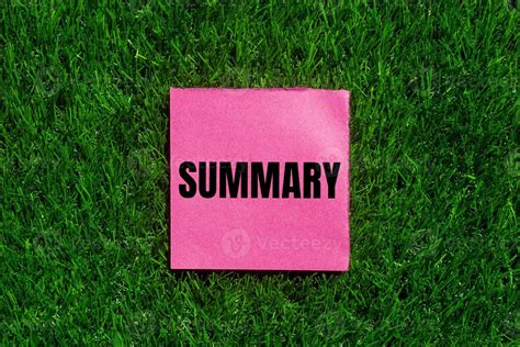 Summary Message Written On Ripped Torn Pink Paper With Green Grass Background Conceptual