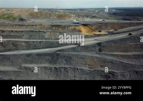 An Expansive And Extensive Openpit Mining Operation Showcasing Heavy
