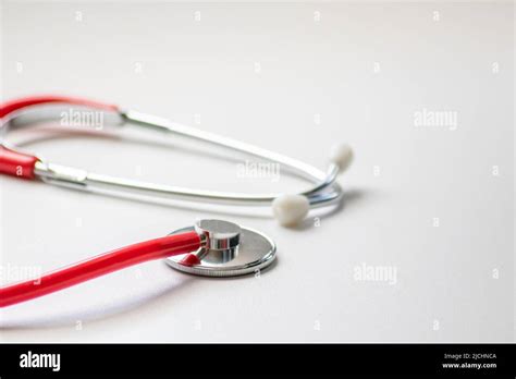 Red Stethoscope In Doctors Office For Professional Cardio Checkup And Healthy Heartbeat Pulse