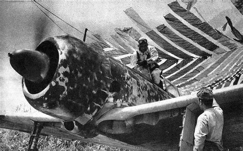 A Japanese Ijaaf Pilot Climbing Into The Cockpit Of His Nakajima Ki 43