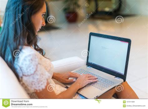 Female Hands On Keyboard With Opened Web Page In Browser At Screen