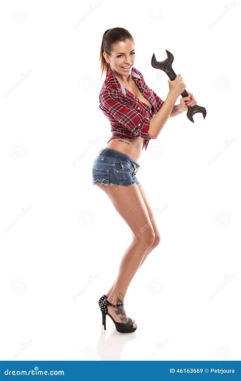 Mechanic Is Holding The Oil Dipstick Check The Oil Level In Car Engine Royalty Free Stock Photo