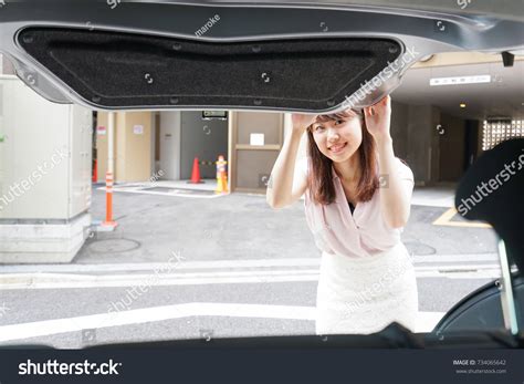 Woman Opening Trunk Stock Photo Shutterstock