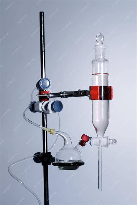 Premium Photo Fixed Flask On Support On Light Blue Background