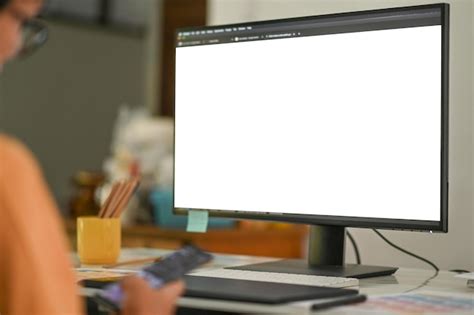 Premium Photo Programmer And Mockup Blank Screen Computer On A Programming Desk