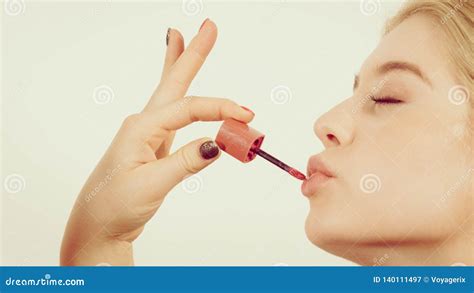 Woman Applying Lipstick Or Lip Gloss Stock Image Image Of Beautiful Care 140111497