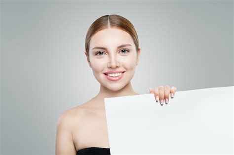Premium Photo Perfect Model Girl Showing White Empty Paper Signboard