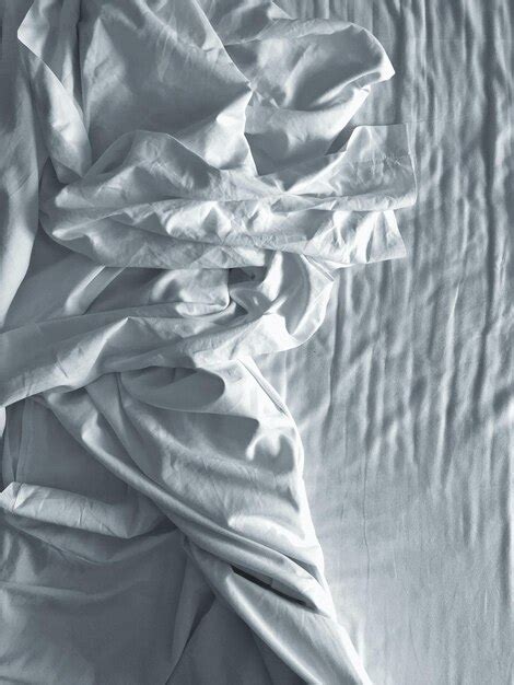 Premium Photo Crumpled White Bed Sheets