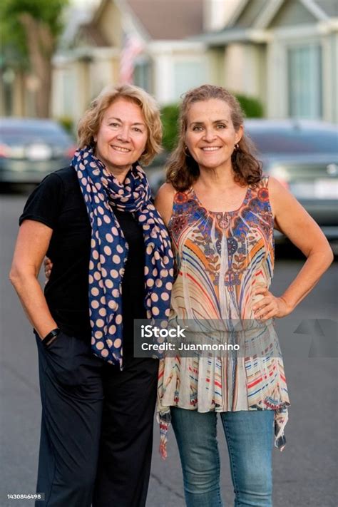 Smiling Happy Mature Lesbian Couple Posing Looking At The Camera Stock