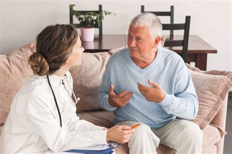 Female Professional Doctor Showing Medical Test Result Explaining