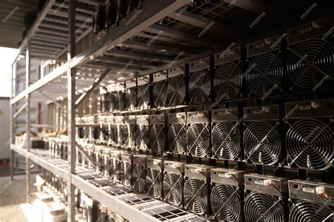 Premium Photo Bitcoin Asic Miners In Warehouse Asic Mining Equipment On Stand Racks For Mining