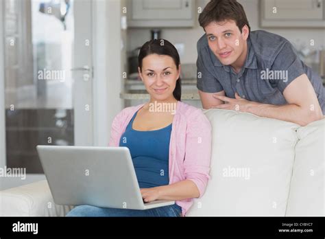 Couple Using The Laptop Together Stock Photo Alamy