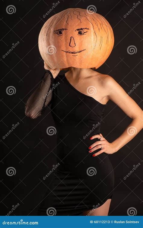 Woman In A Black Dress With A Pumpkin On Head Stock Image Image Of
