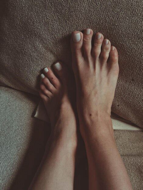 Premium Photo Low Section Of Woman On Bed