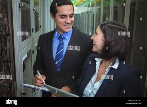 Technicians Interacting With Each Other While Analyzing Server Stock