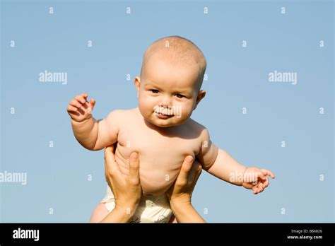 A Nacked Baby In Front Of The Blue Sky Stock Photo Alamy