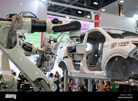 A Robot Arm Display Working On A Car In The Smart China Expo In