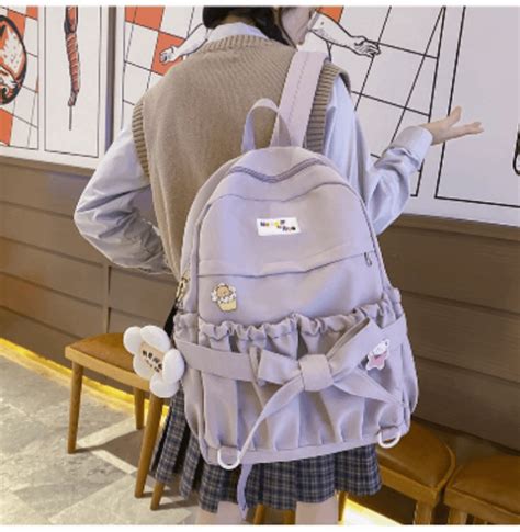 무료배송뱃지증정 쭈리 리본묶음 백팩 10대 20대백팩 학생가방 학교가방 신학기 새학기 캔버스 책가방 중학생 고등학생 대학생 스쿨백 심플 유니크 여행가방 퍼플 베이지 블랙