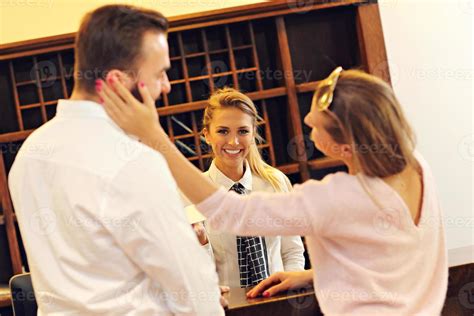 Couple At Reception Desk In Hotel 15884366 Stock Photo At Vecteezy
