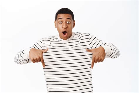 Shocked Black Guy Pointing Fingers Down Looking Impressed Drop Jaw And Say Wow Standing Over