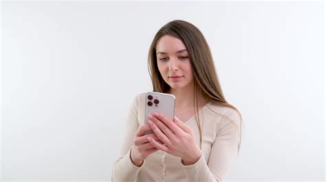 Young Woman Using Cellphone Swiping And Texting Message Grey