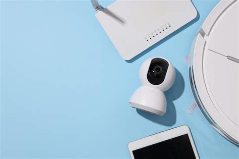 Premium Photo Robot Vacuum Cleaner Router Security Camera And Tablet On Blue Background Space