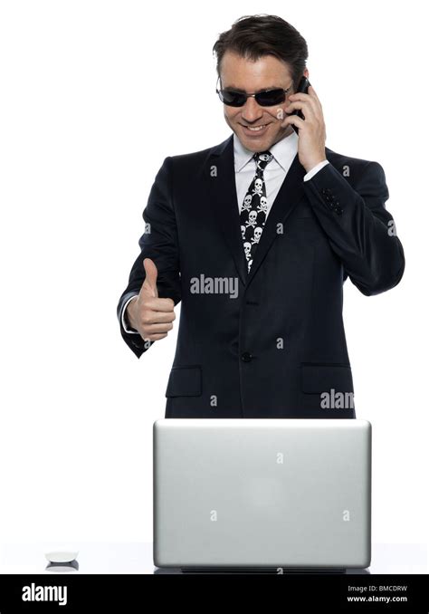 One Criminal Man Computer Hacker Caucasian Computing On The Phone Happy Satisfied In Studio