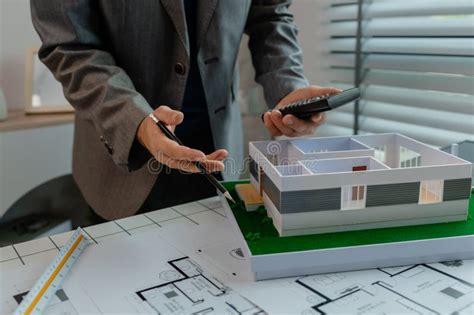 An Engineer Is Calculating Whether The Structural Proportions Of A House Model Are Correct With