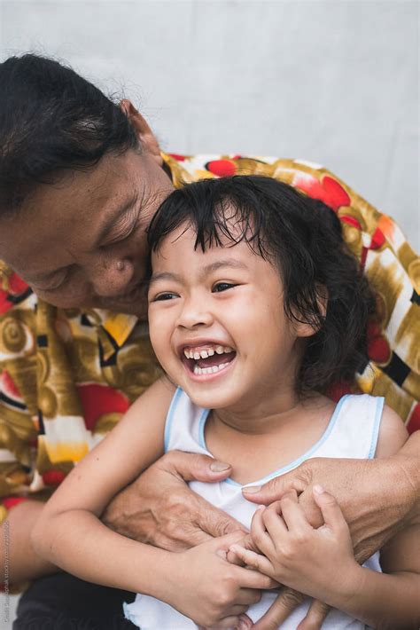 Asian Grandmother And Her Granddaughter By Stocksy Contributor