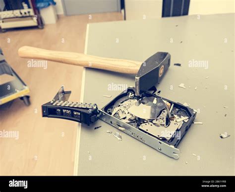Destroying Computer Hard Drive With A Hammer Stock Photo Alamy