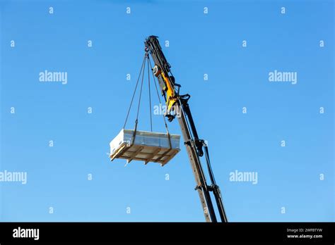 Crane Moves Large Electrical Component For Radio Wave Repeater Stock