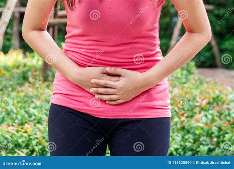 Asian Woman Touching Her Own Underbelly With Stomachache Or Menses