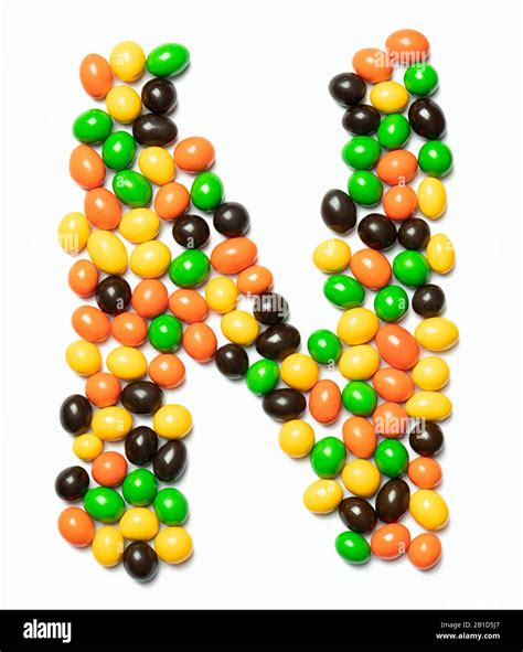 Letter N Of The English Alphabet From Multicolored Round Chocolates On