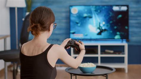 Closeup Of Woman Holding Controller Celebrating Victory In Online First