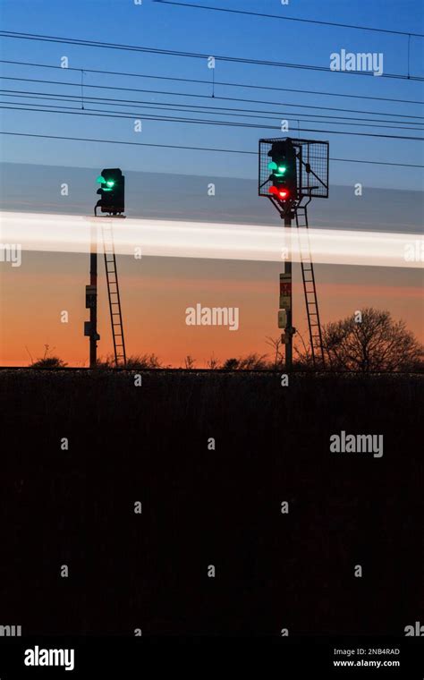 Grand Central Train Passing 4 And 3 Aspect Colour Light Railway Signals At Sunset Signals Y347