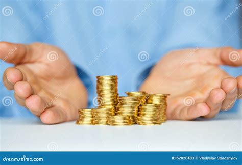 Protect New Business Start Up With Hands And Coin Stock Image Image