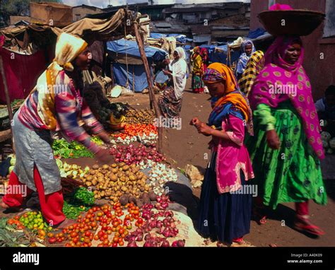 Ethiopia Harar Vegetable Market Woman Selling At Vegetable Stall And Colourfully Dressed Women