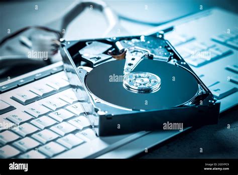 Hard Drive On Keyboard In Blue Tone Stock Photo Alamy
