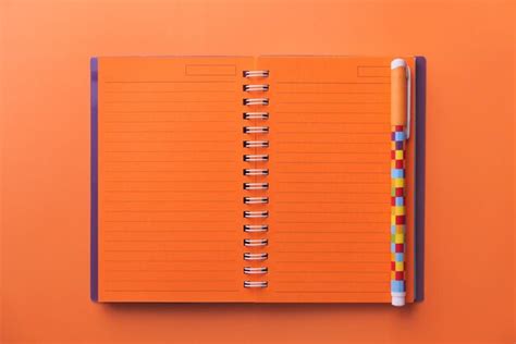 Premium Photo Top View Of Orange Color Notepad