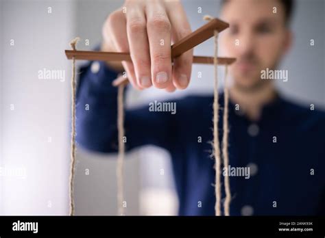 Man Hand Puppet Strings High Resolution Stock Photography And Images Alamy