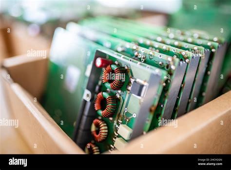 Green Control Chips Of Contemporary Tft Monitors In Small Cardboard Box In Assembling Workshop