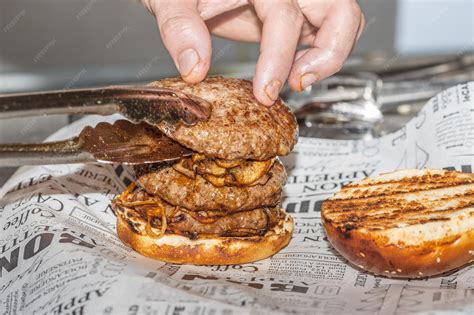 Premium Photo Assembling A Hamburger
