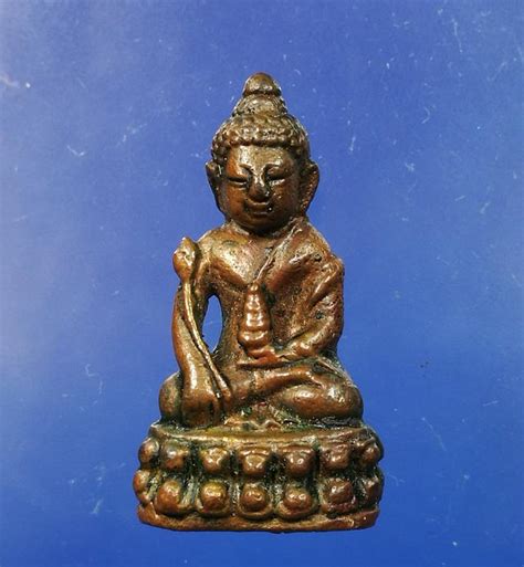 พระกริ่งถือบัว หลังยันต์ ก้นอุดผง เก่า ไม่ทราบที่ Ennxo